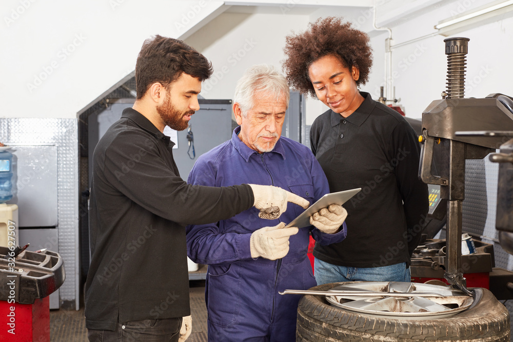 Auto mechanic team with tablet computer Stock Photo | Adobe Stock