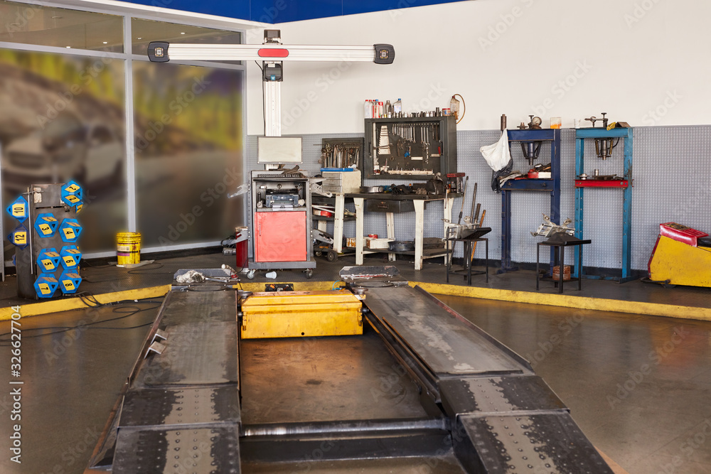 Lifting platform and other equipment in a car workshop Stock Photo ...