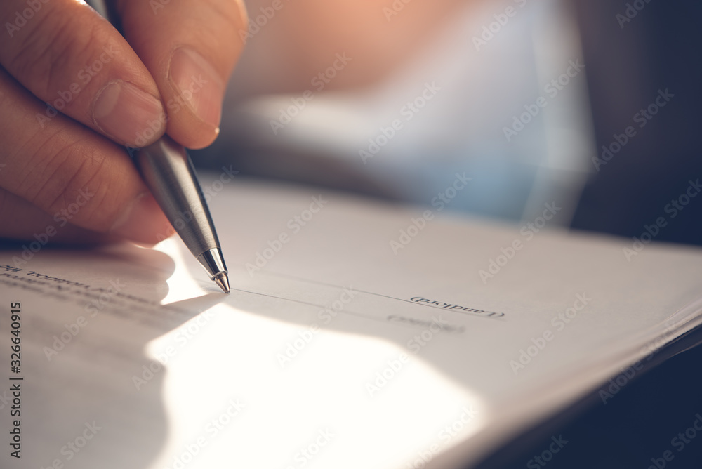 Signing contract Stock Photo | Adobe Stock