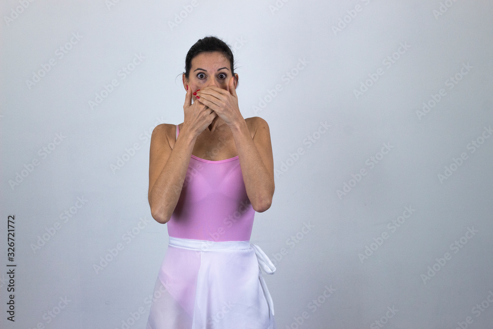 Portrait of shocked scared ballet dancer, middle age woman model ...