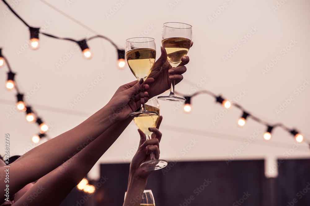 Cheers! Group of people cheering with champagne flutes with party ...