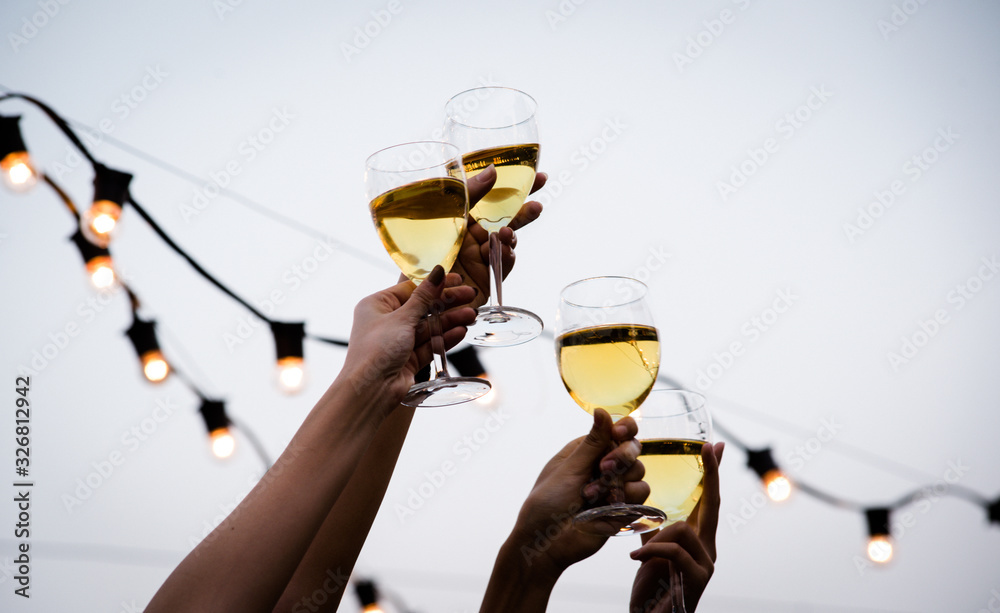 Cheers! Group of people cheering with champagne flutes with party ...