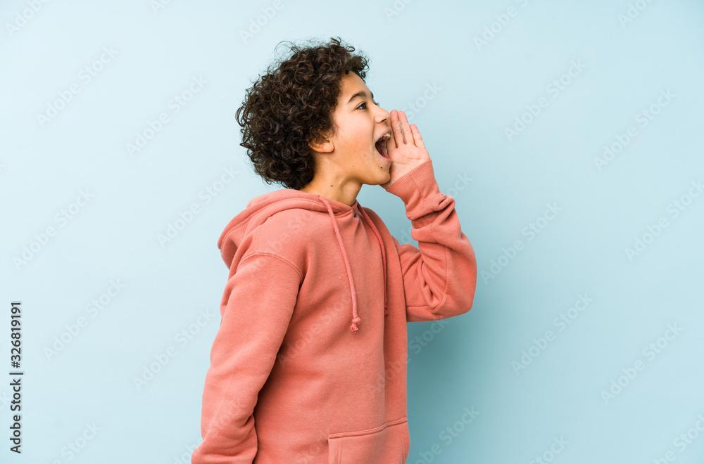 African american little boy isolated shouting and holding palm near ...