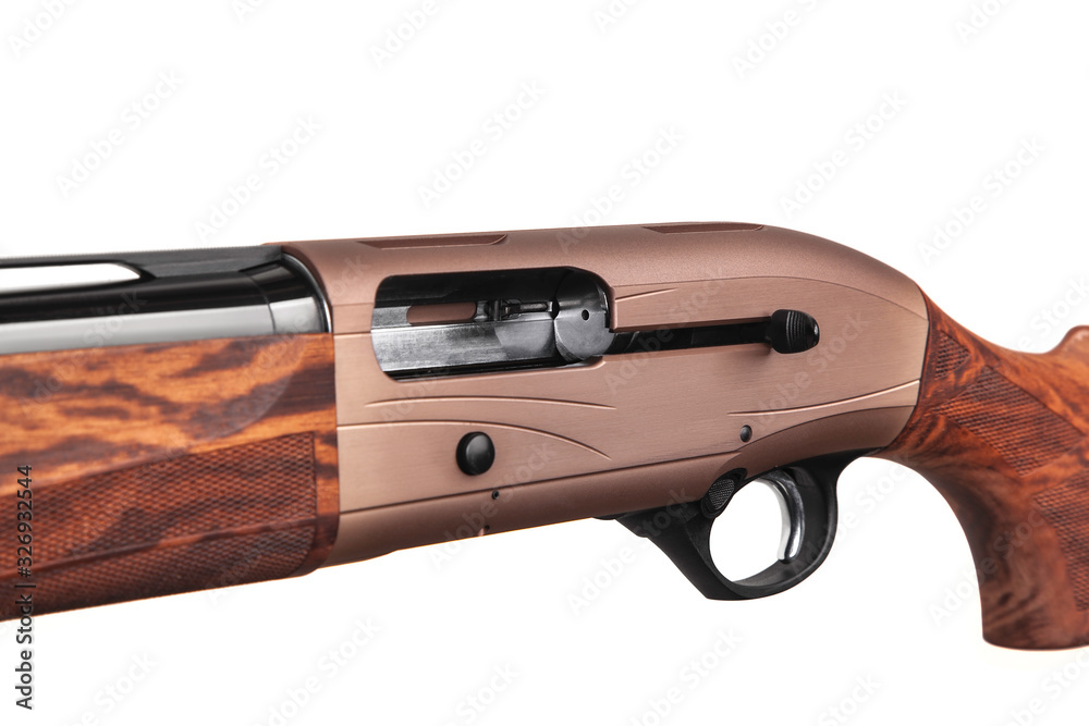 Left-handed shotgun. Hunting semi-automatic shotgun with a wooden butt ...