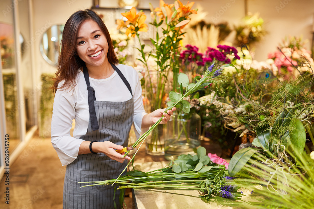 Florist tying flowers for Valentine's Day Stock Photo | Adobe Stock