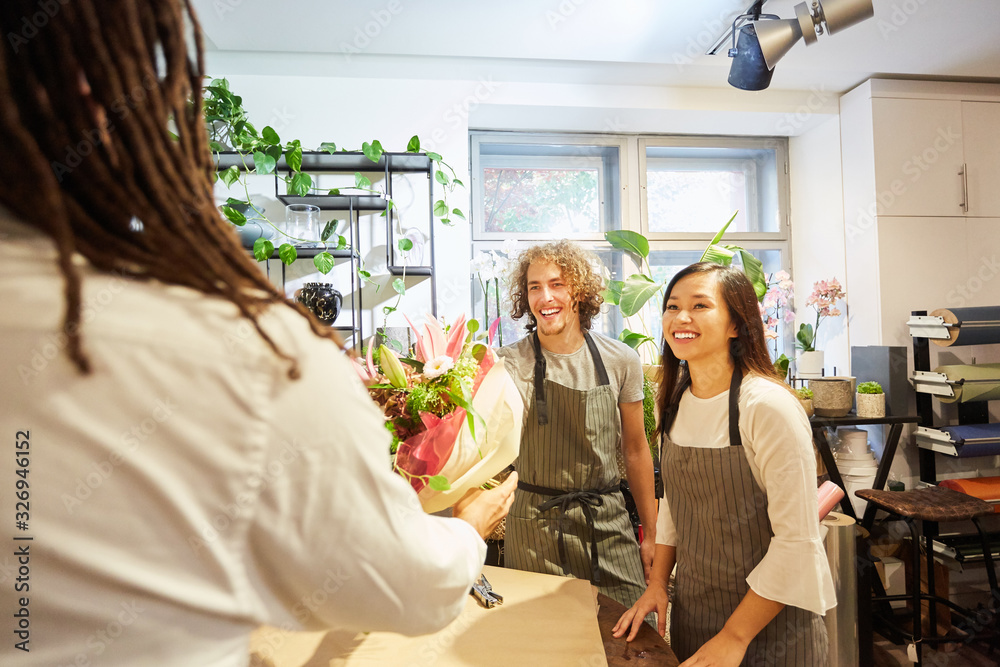 Florist team gets a bunch of flowers Stock Photo | Adobe Stock