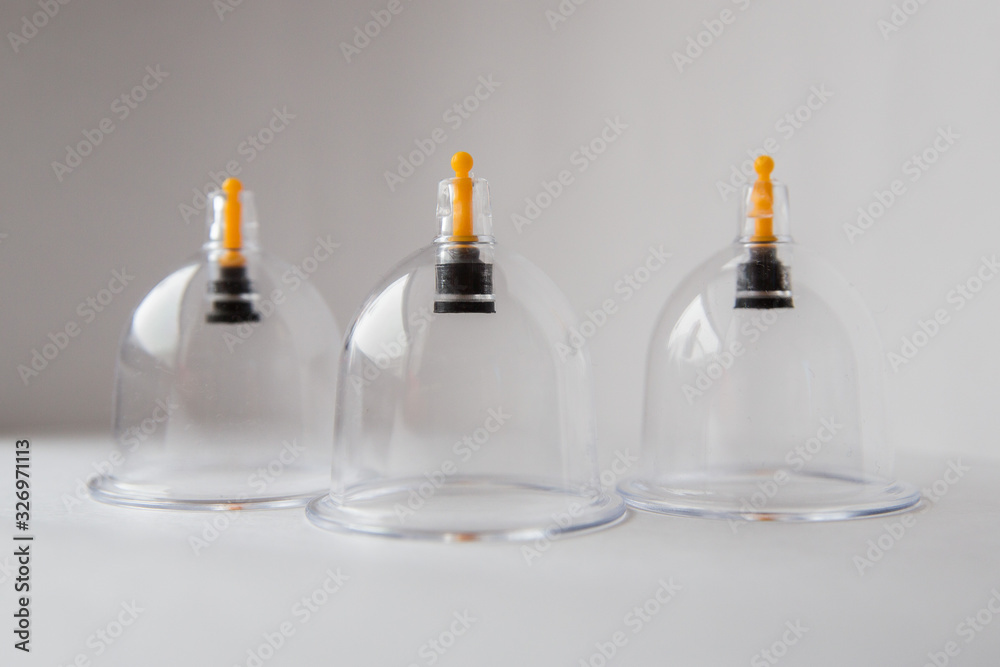 three hijama jars on a white background in a row Stock Photo | Adobe Stock