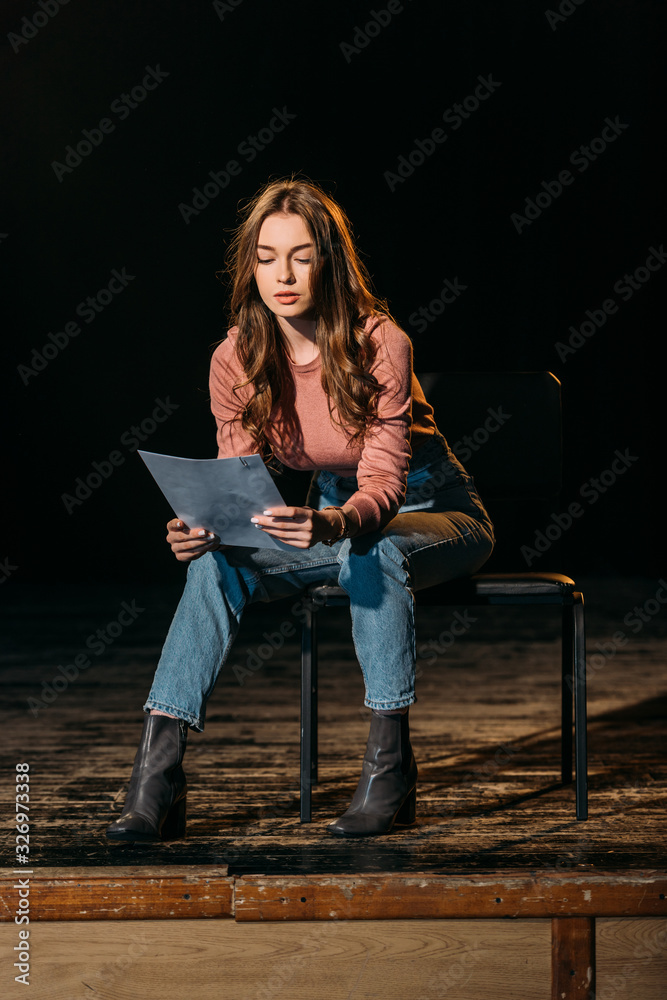 beautiful young actress reading screenplay on stage in theatre Stock ...