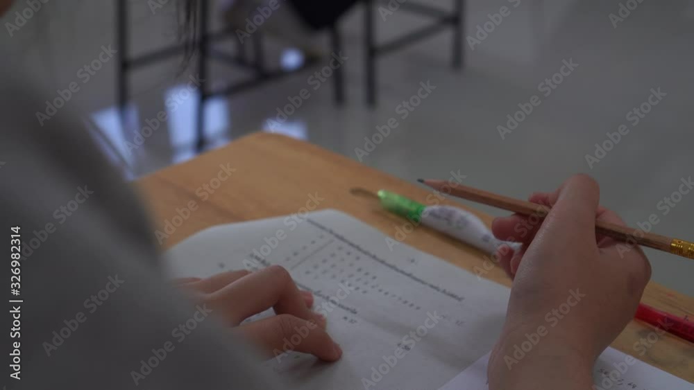 Student hand testing doing test exam with pencil drawing selected ...