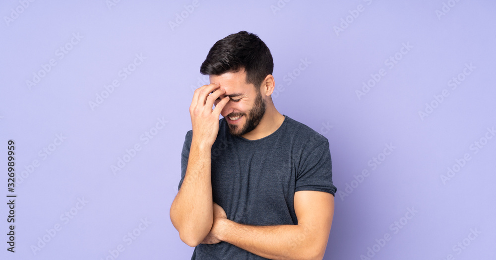 Caucasian handsome man laughing over isolated purple background Stock ...