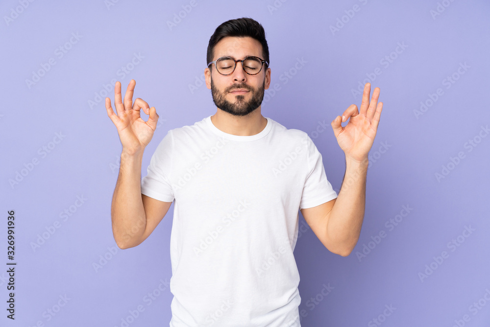 Caucasian handsome man over isolated background in zen pose Stock Photo ...