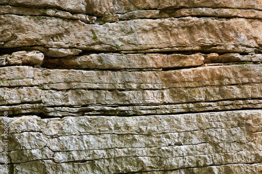 Texture, background layers and cracks in sedimentary rock on cliff face ...
