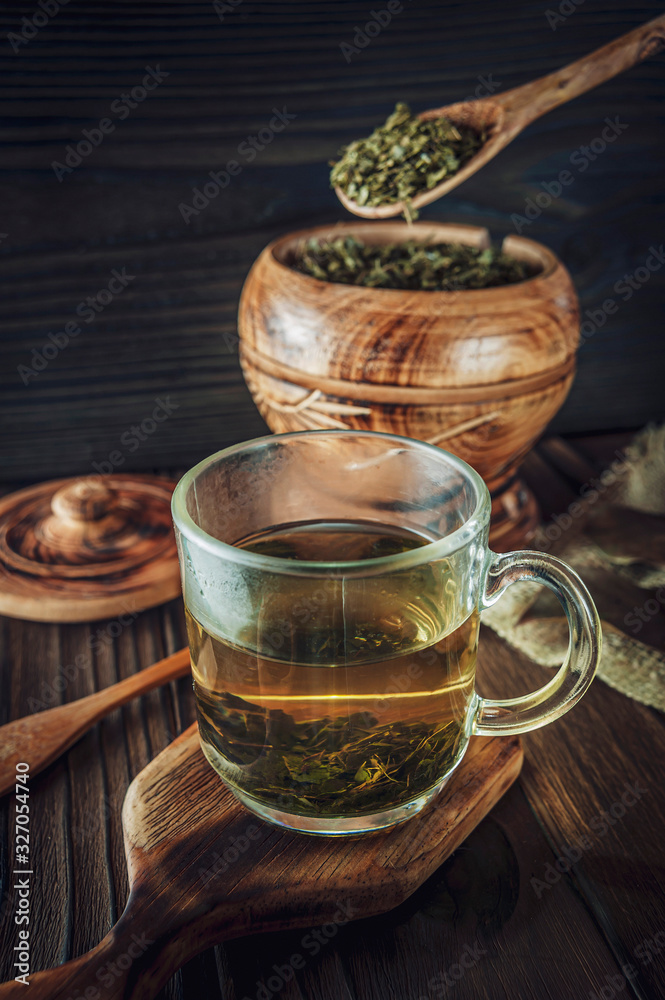 A cup of medicinal soursop tea with dried soursop leaves. Stock Photo ...