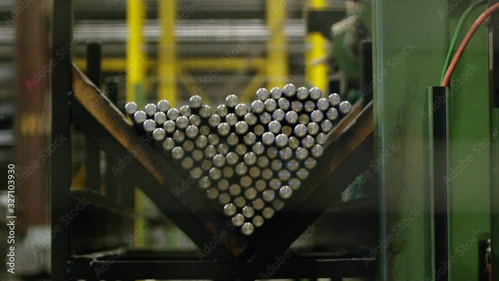 Steel Rods Falling into Place Into Triangular Bin At Manufacturing ...