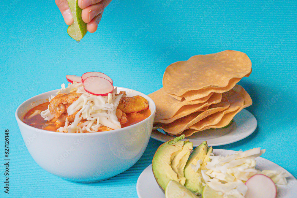 Delicious typical Mexican red Mexican pozole with tostadas Stock Photo ...