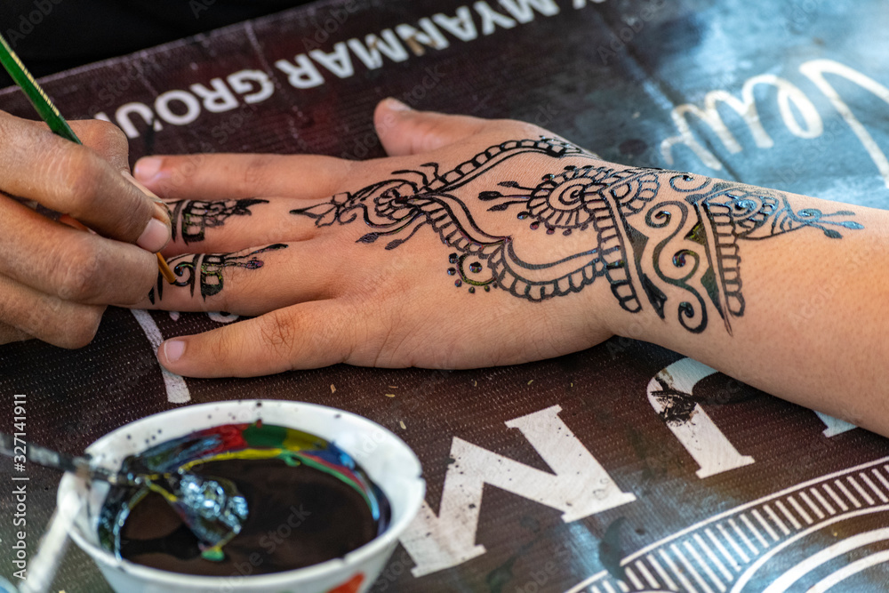 Traditional henna hand painting at Maha Sandar Mahi Pagoda Stock Photo ...