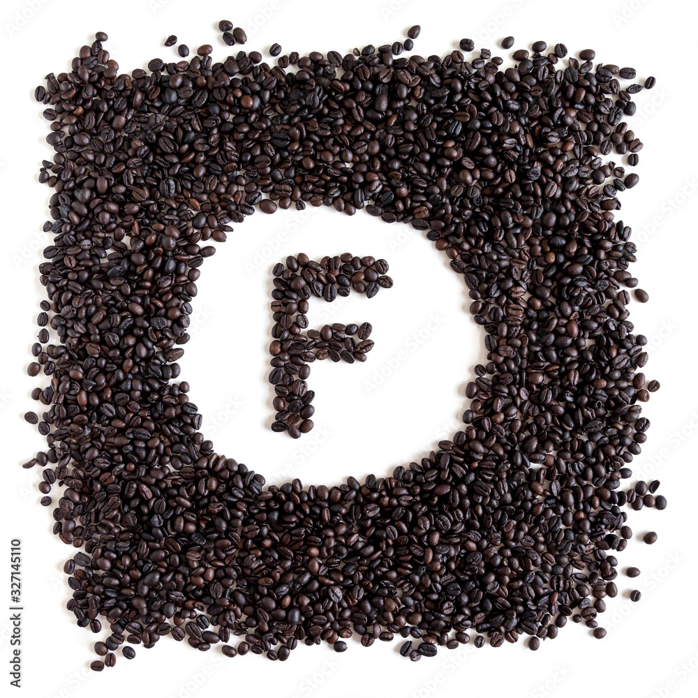 Letter F made out of aromatic coffee beans, top view, isolated on white ...
