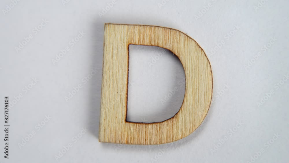 Dancing letter D of the English alphabet in motion on a white ...