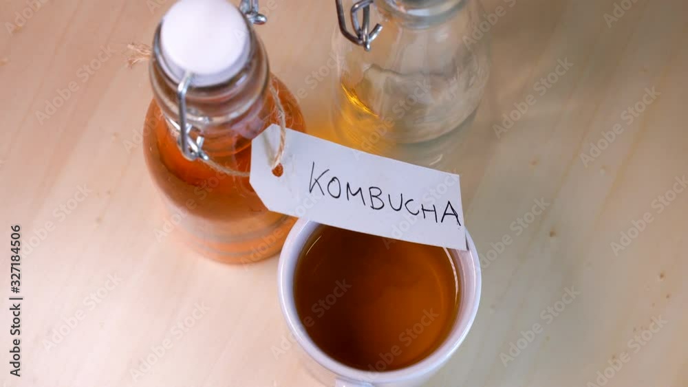 Handwritten label on a bottle of homemade Kombucha. It is a fermented ...