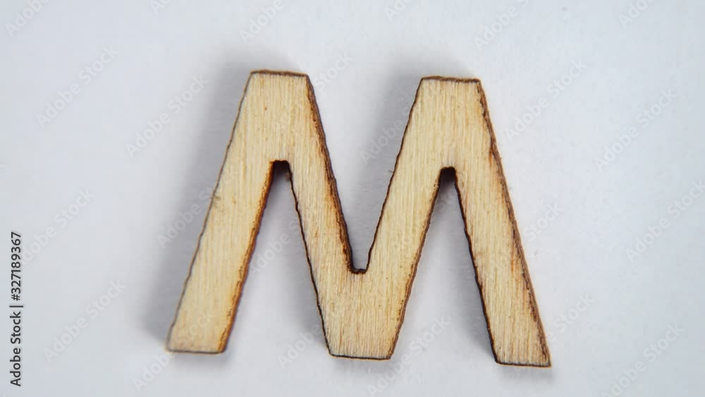 Dancing letter M of the English alphabet on a white background. Font ...
