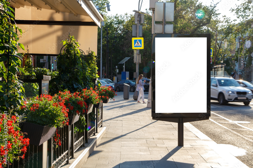 Vertical billboard to the right of a cafe with pilargoniums. Stock ...