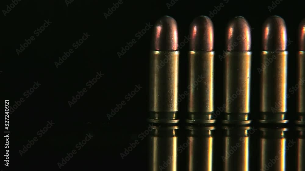 Bullets in a row. Group of bullets on the table slider shoot. Bullets ...
