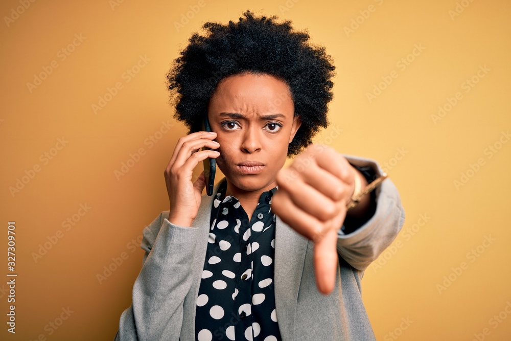 Young African American afro woman with curly hair having conversation ...