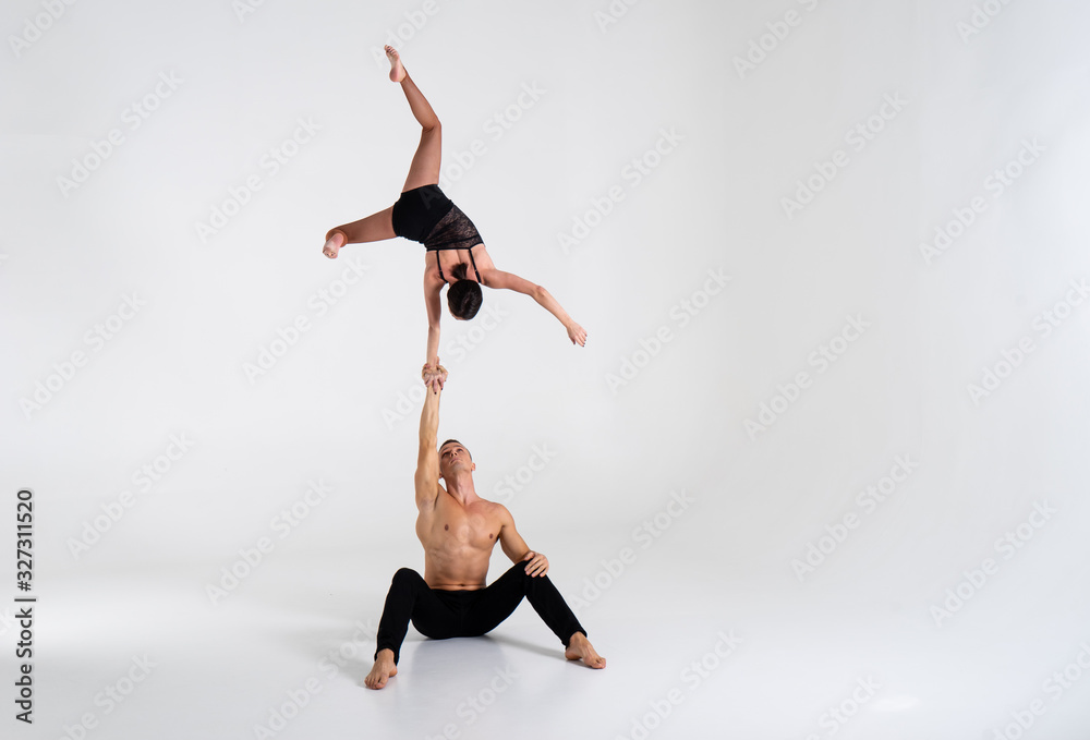 Duo Of Acrobats Showing hand to hand Trick, Isolated On White Stock ...