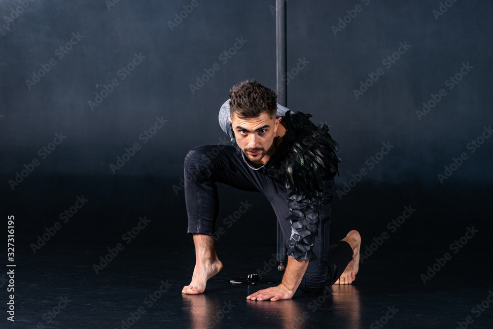 Performance concept. Man hanging on chinese pole. Athlete performing ...