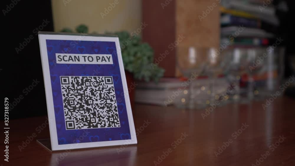 Display with QR code in the store. QR code payment is a contactless ...