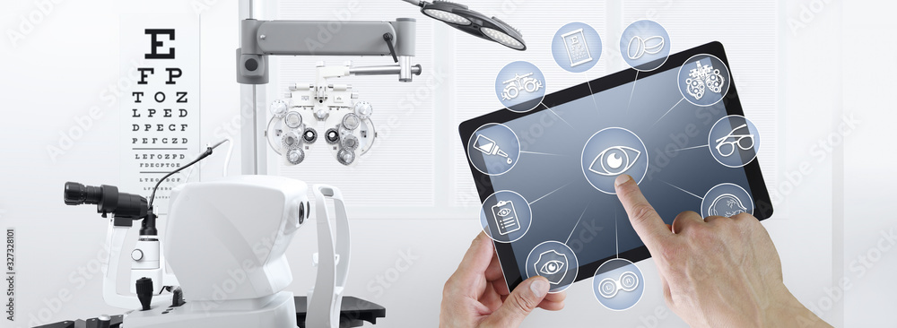 hands touch screen of digital tablet with ophthalmologist and ...