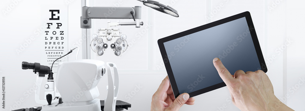 eye examination test concept, hands touch screen of digital tablet ...