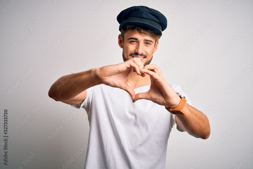 Young driver man with beard wearing hat standing over isolated white ...