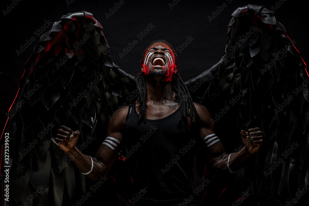 dark naked angel screaming from hopelessness and pain. black angel with ...