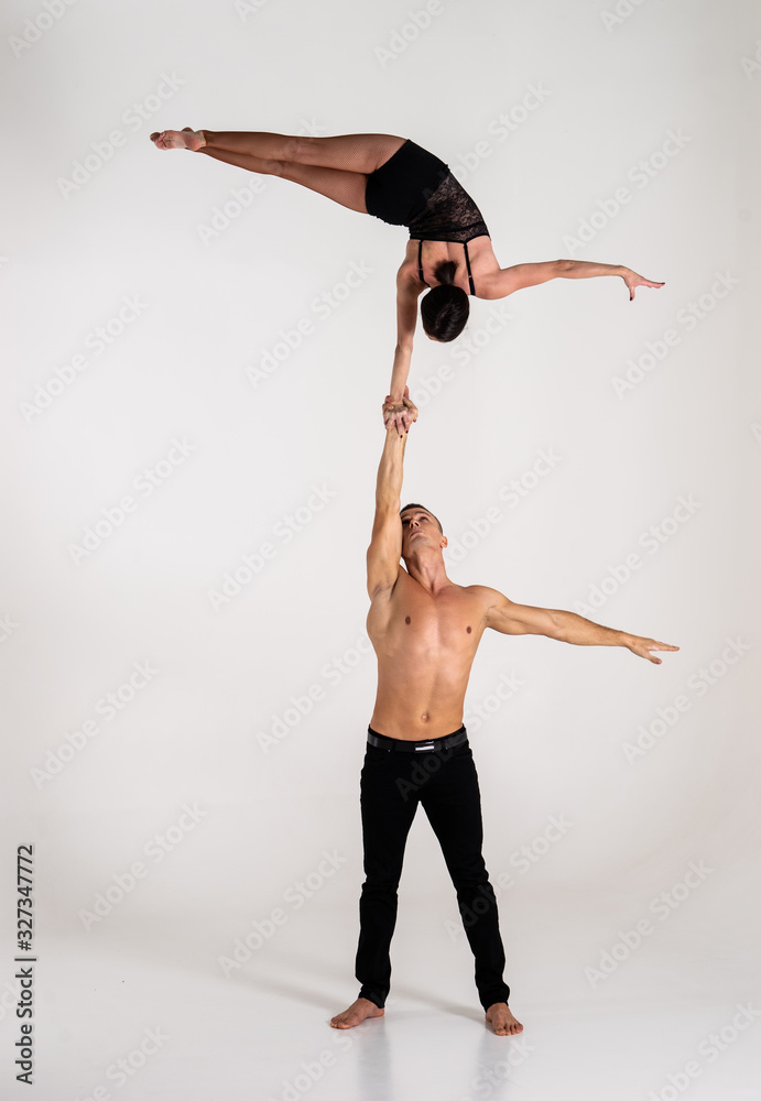 Duo Of Acrobats Showing hand to hand Trick, Isolated On White Stock ...