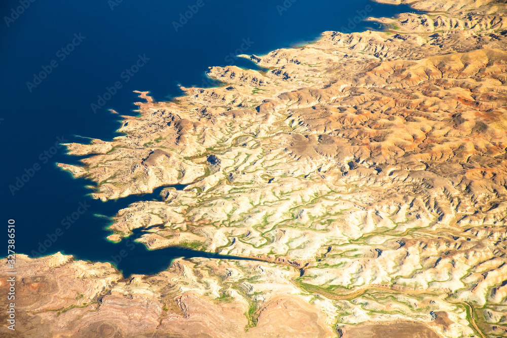 Aerial Photography of landforms over Nevada with Lake Mead in view ...