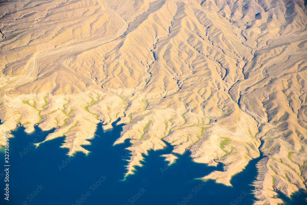 Aerial Photography of landforms over Nevada with Lake Mead in view ...