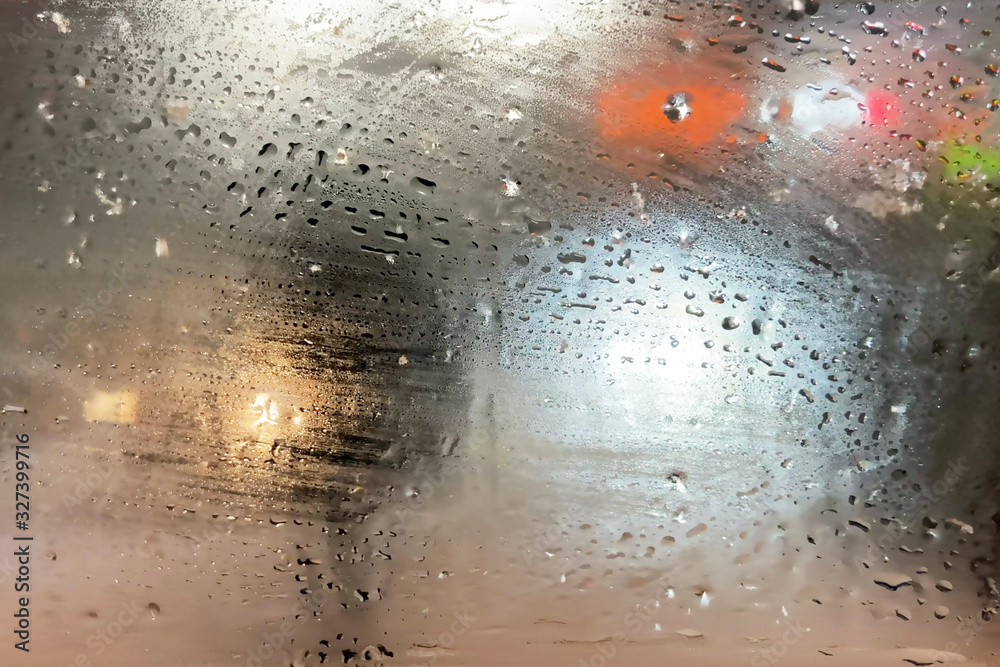 Foggy car window in snowfall winter day with traffic light and ...