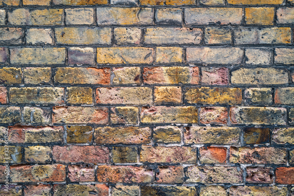 Old brick wall texture with various colours and pit marks in the bricks ...