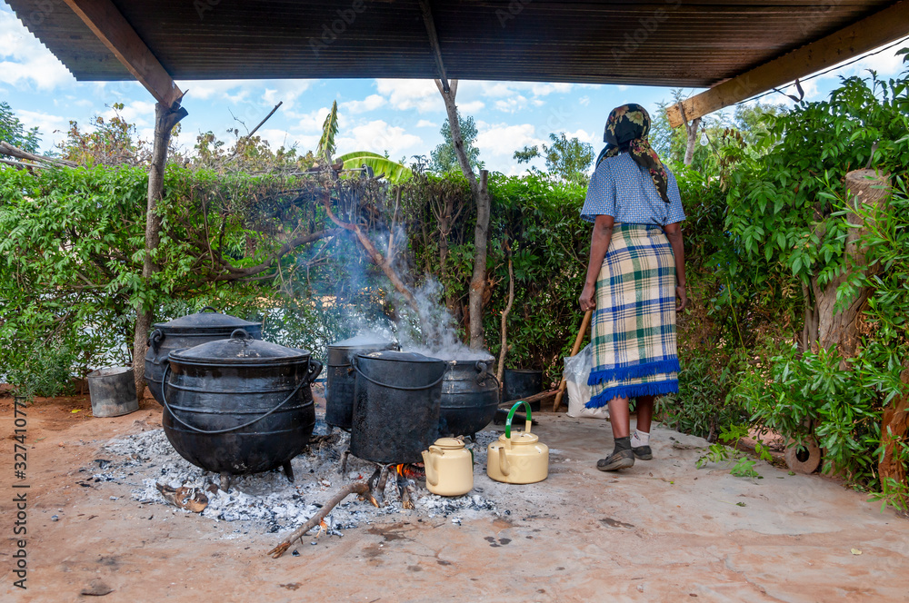 African woman cooking outdoors Stock Photo | Adobe Stock