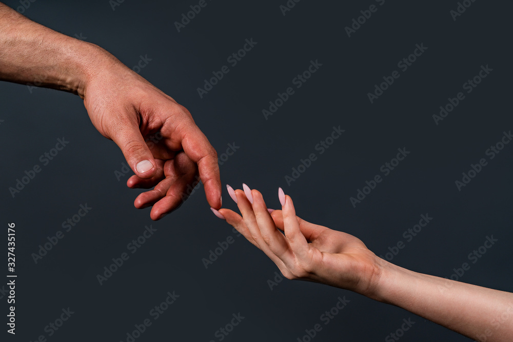 Touch. Moment of weightless. Male and female hands trying to touch like ...