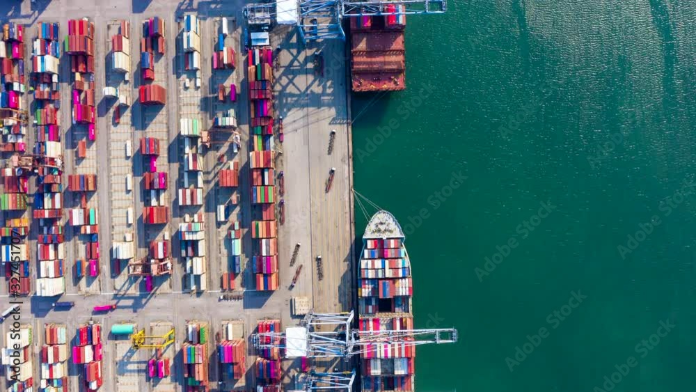 Container ship loading and unloading in deep sea port, Aerial view ...