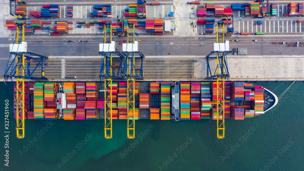 Container ship loading and unloading in deep sea port, Aerial view ...