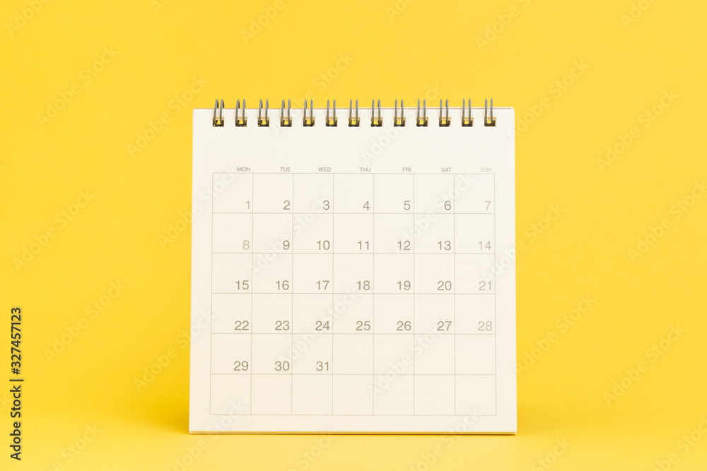 Clean desktop calendar with date 31 days on solid yellow background ...