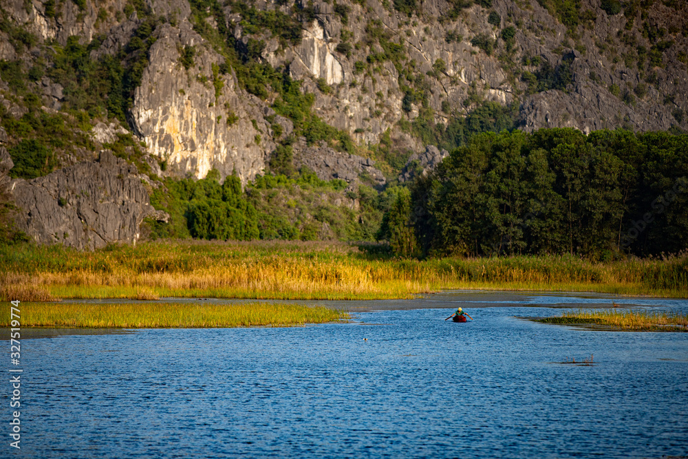 boat on Van Long Lagoon-the biggest wetland nature reserve site in the ...