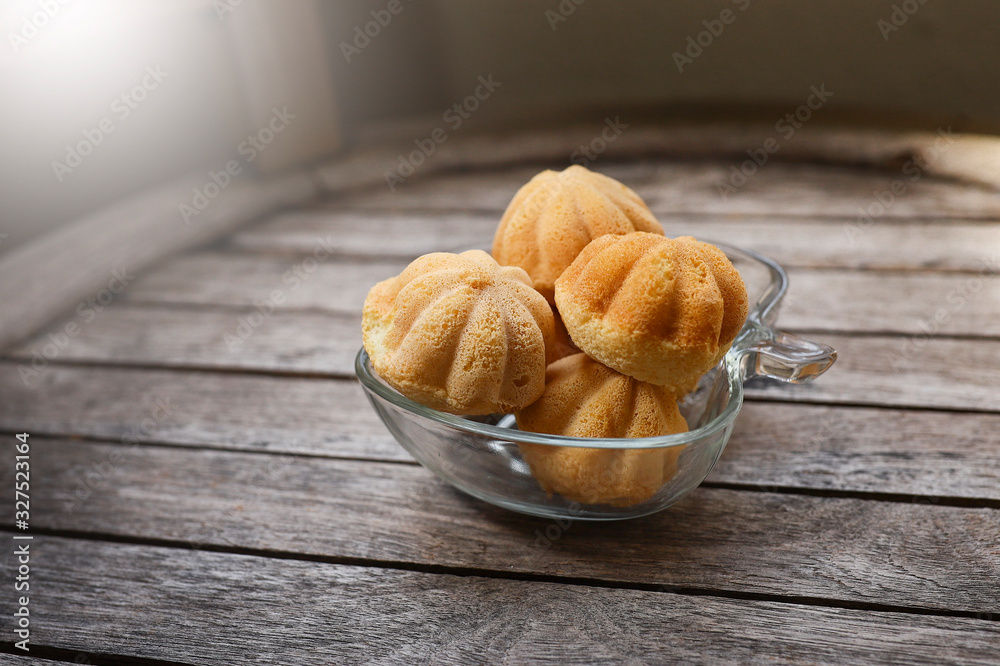 A bowl of Kuih Bahulu or Baulu. Made from eggs, flour and sugar among ...