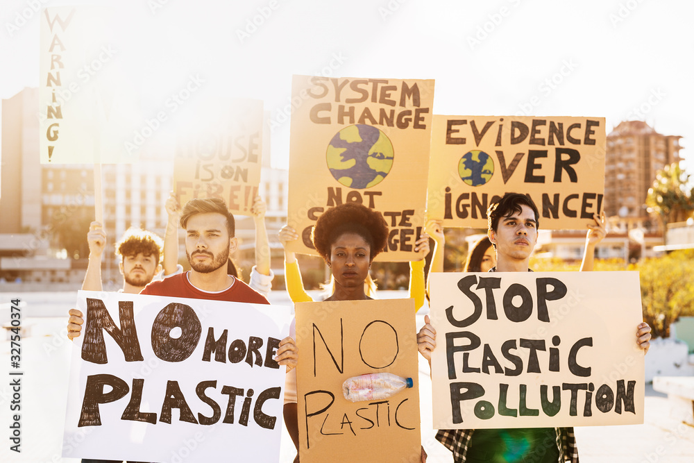 Group demonstrators protesting against plastic pollution and climate ...