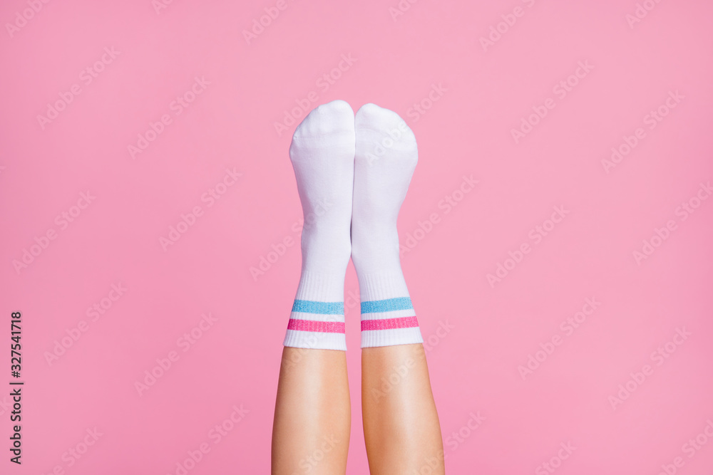 Cropped close-up view of nice vertical feminine legs wearing white ...