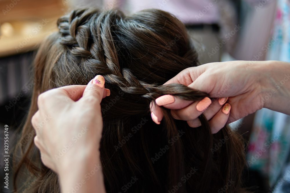 Hairdresser making hairstyle for woman, copy space. Bride morning ...