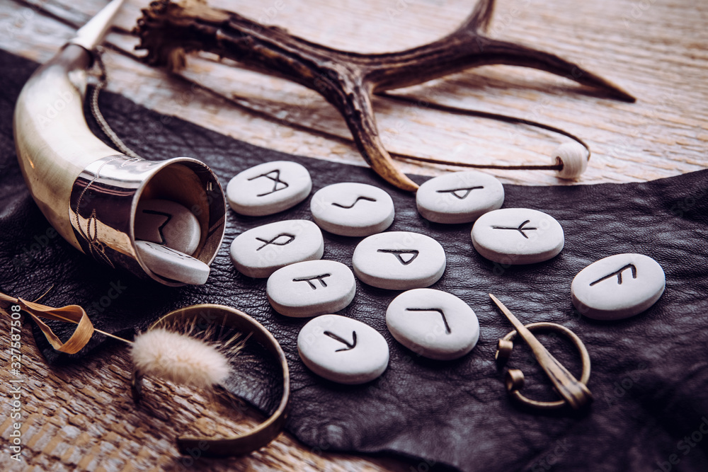 Side view of rune stones with various viking era style objects. Ancient ...